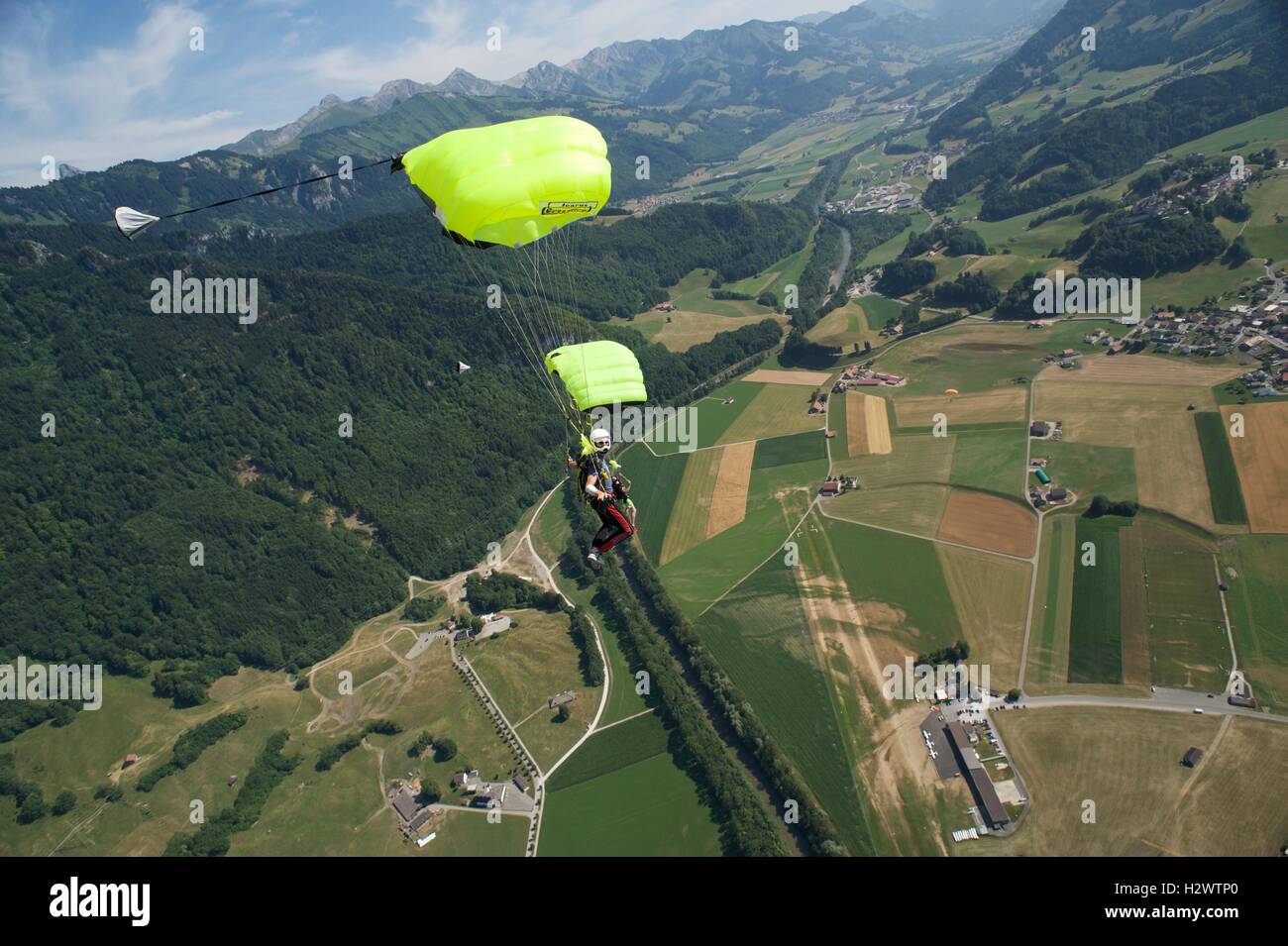 Two parachutes flying back to the airport Stock Photo - Alamy