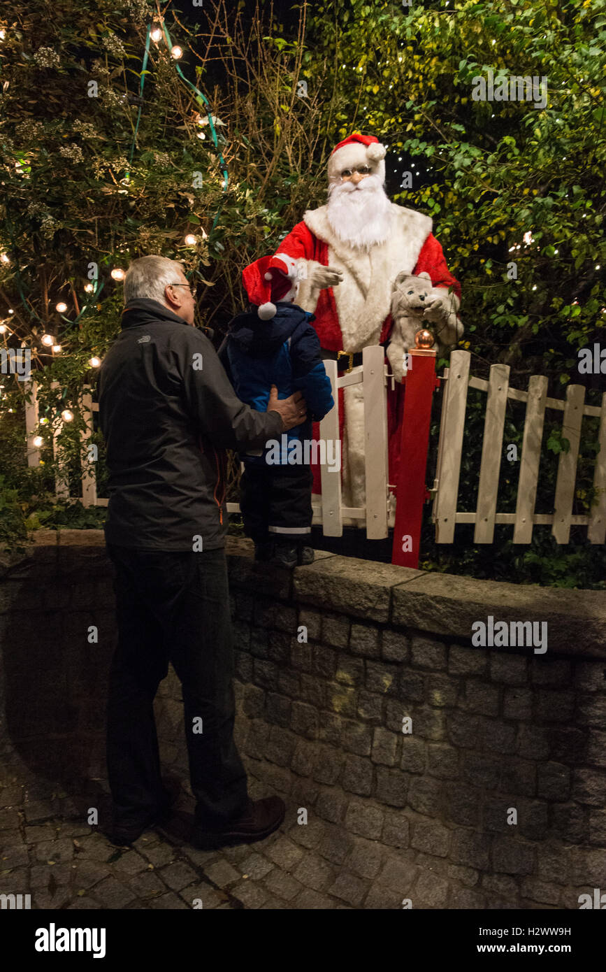 A father and his son meet a Father Christmas at the Kinderweihnacht ...