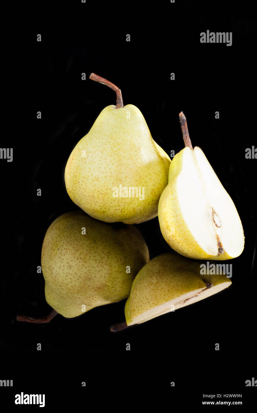 Pears isolated on black Stock Photo - Alamy