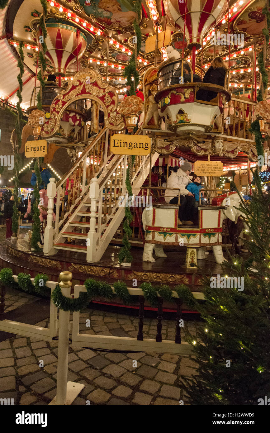 Children enjoying a ride on the biggest attraction, the Merry-go-round ...