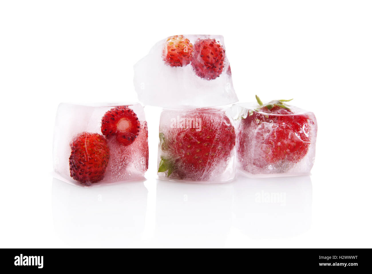 Frozen strawberries in ice cubes Stock Photo - Alamy