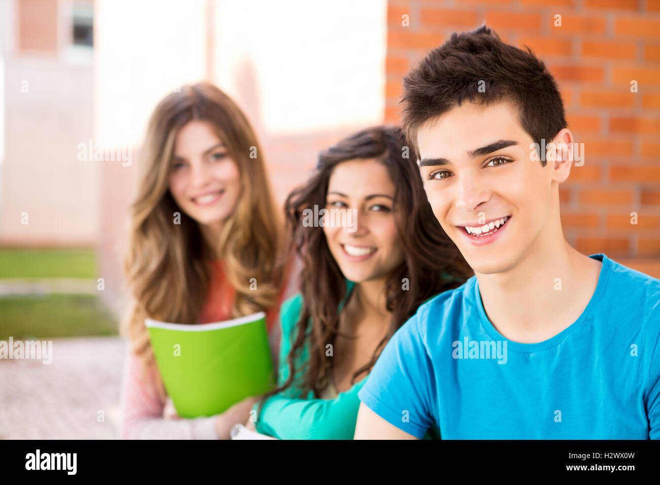 Young group of students in campus Stock Photo - Alamy