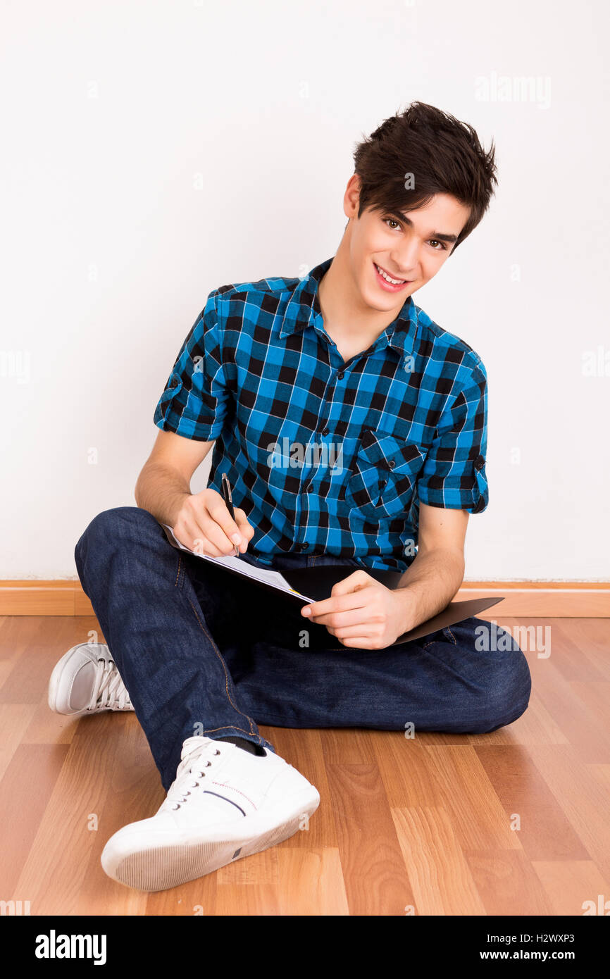 Young man studying at home Stock Photo - Alamy