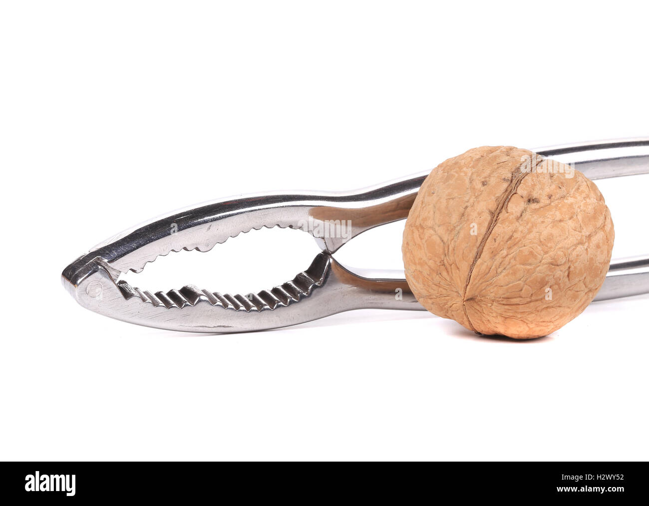 Walnut and nutcracker Stock Photo - Alamy