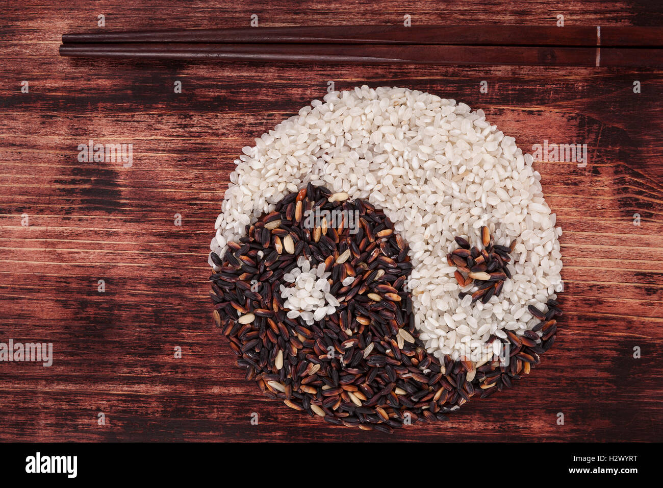 Black and white rice forming a yin yang symbol Stock Photo - Alamy
