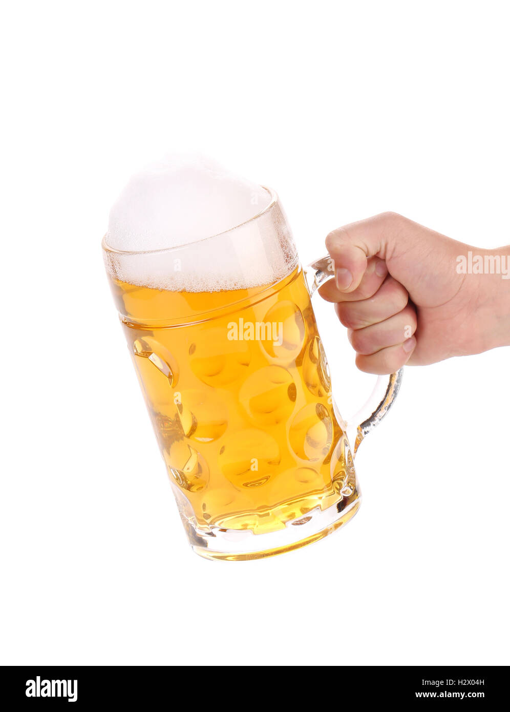 Male hand holding up a glass of beer Stock Photo - Alamy