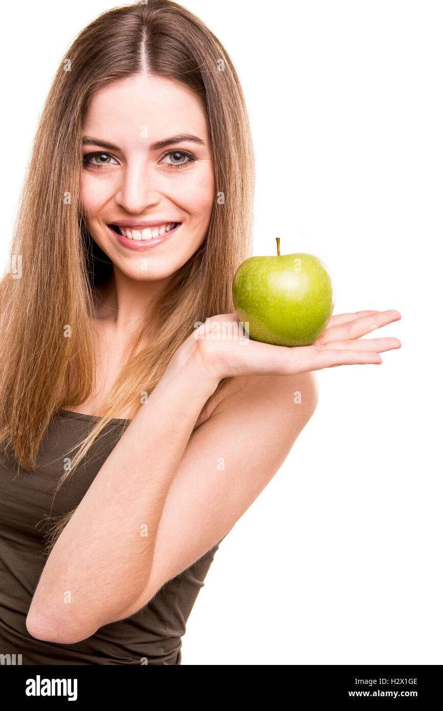 Portrait of a young woman eating green apple Stock Photo - Alamy