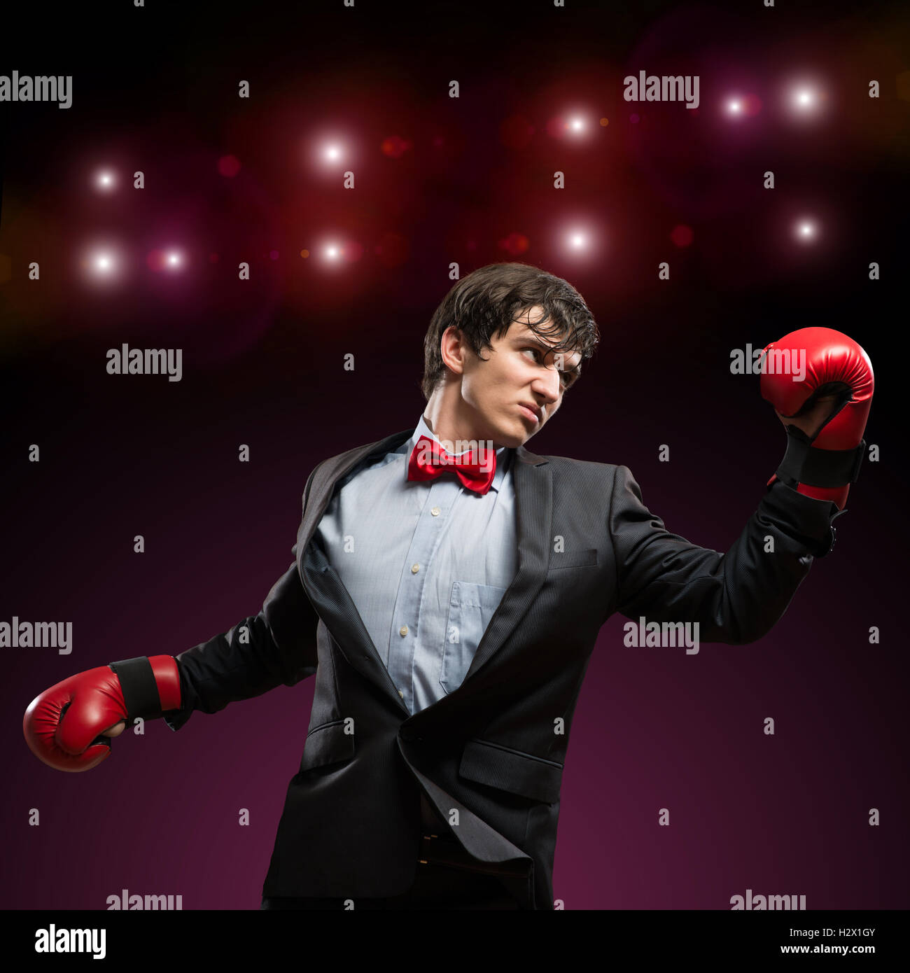 businessman with boxing gloves in the ring Stock Photo - Alamy