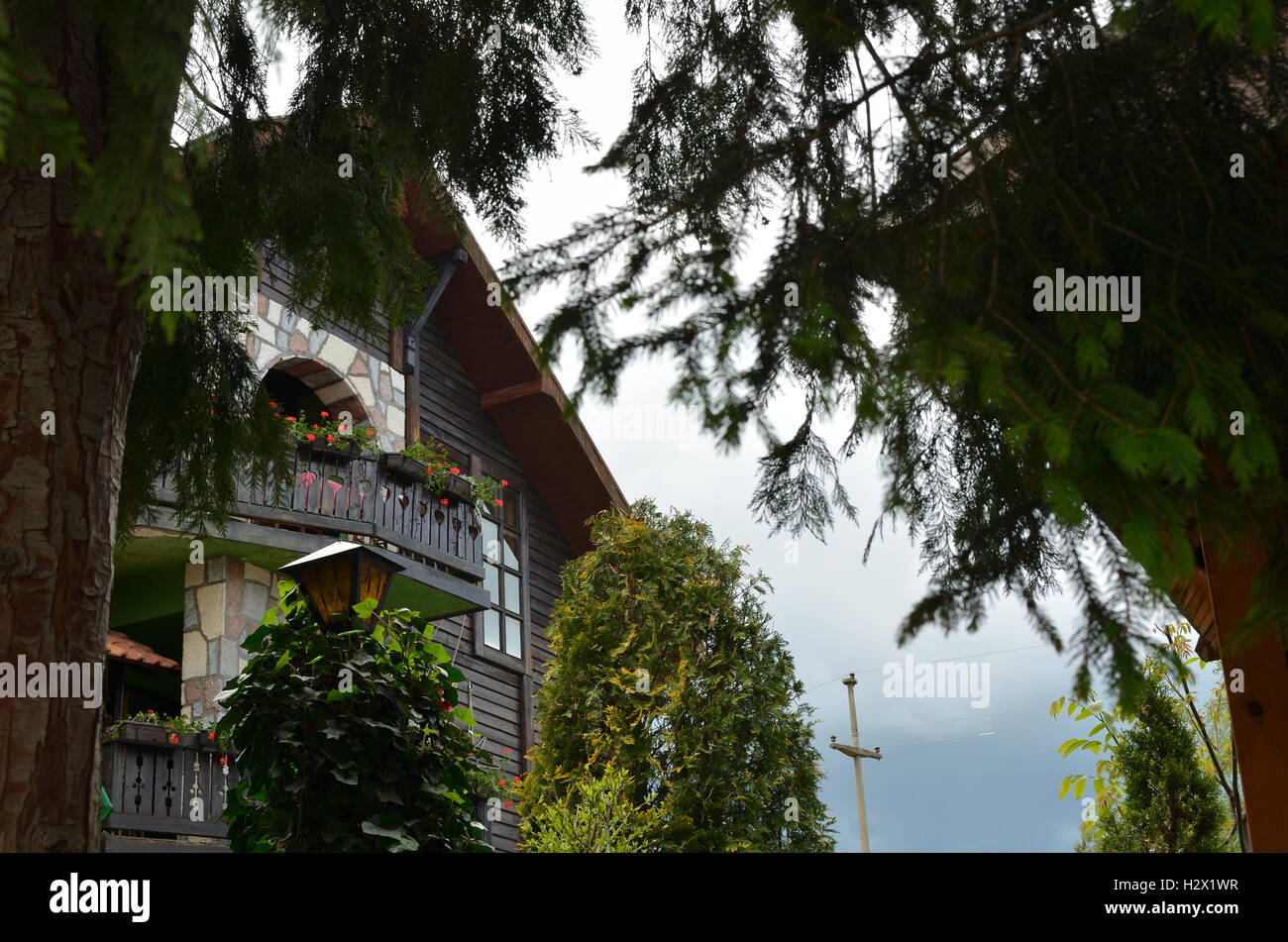 Balcony of a private house with flowers in a mountain style, view ...