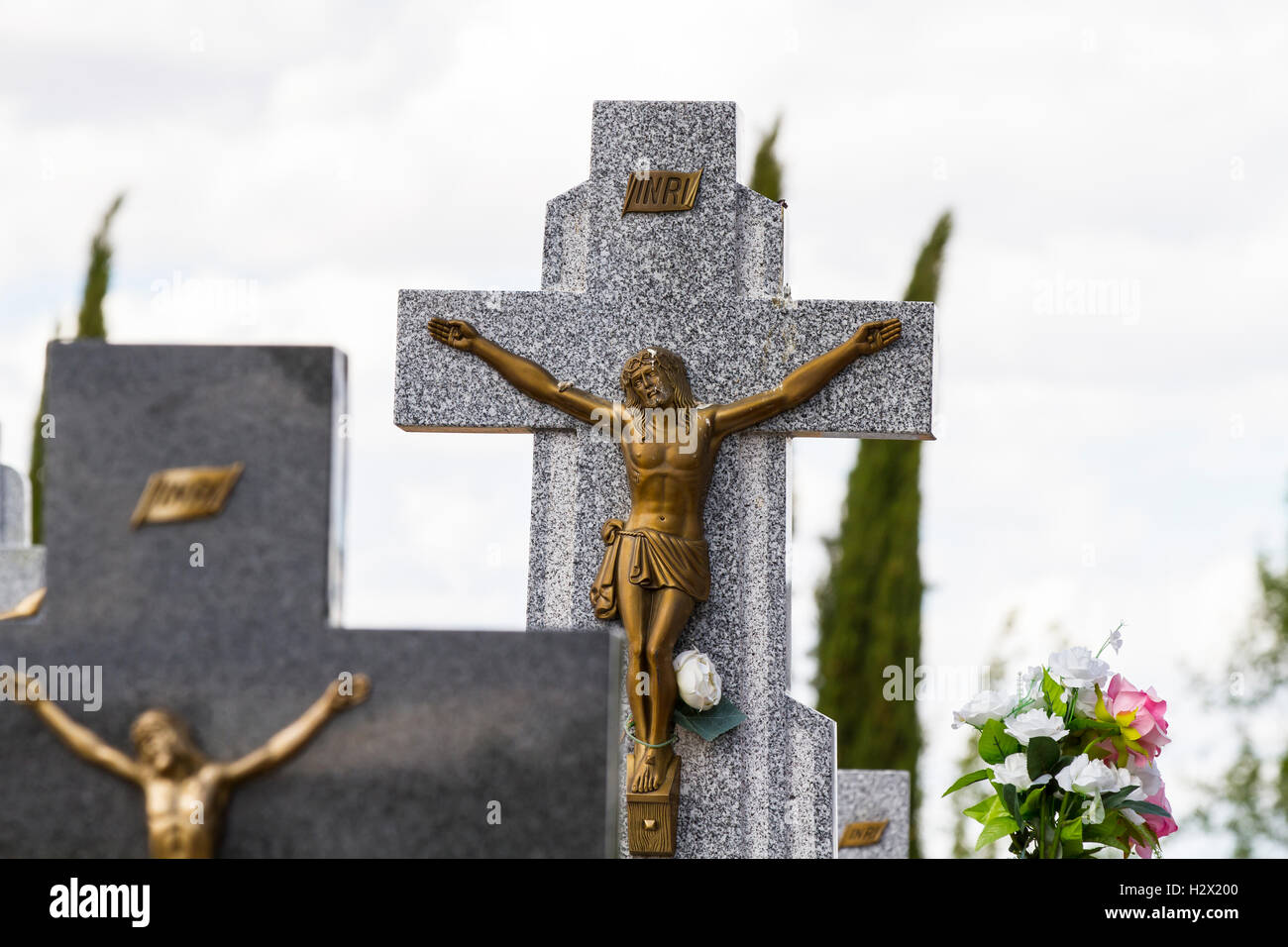 Jesus Christ on the cross in a cemetery Stock Photo - Alamy