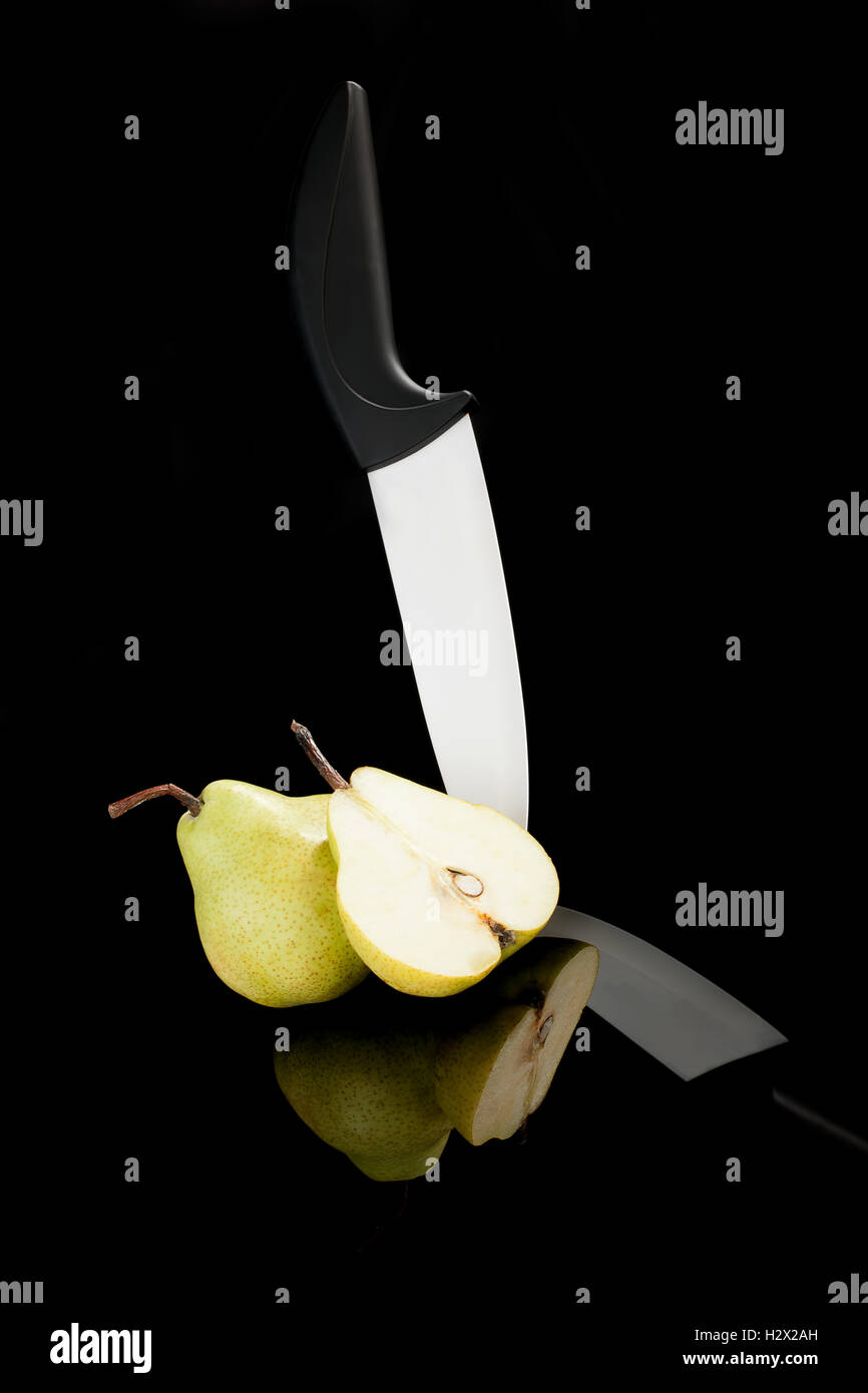 Pear and ceramic knife Stock Photo - Alamy