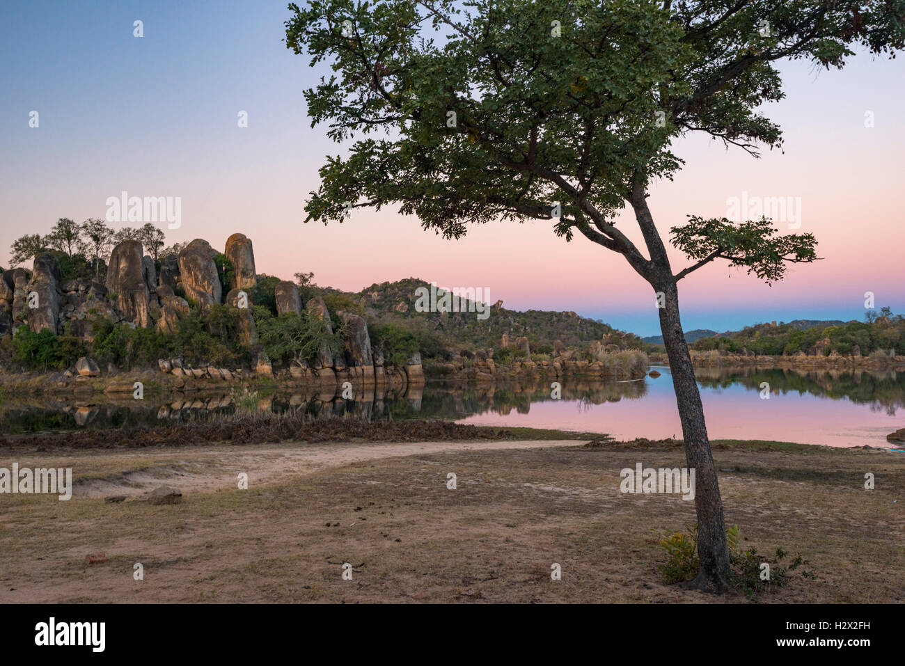 pink sunset balancing rocks Matobo Zimbabwe dam Stock Photo - Alamy