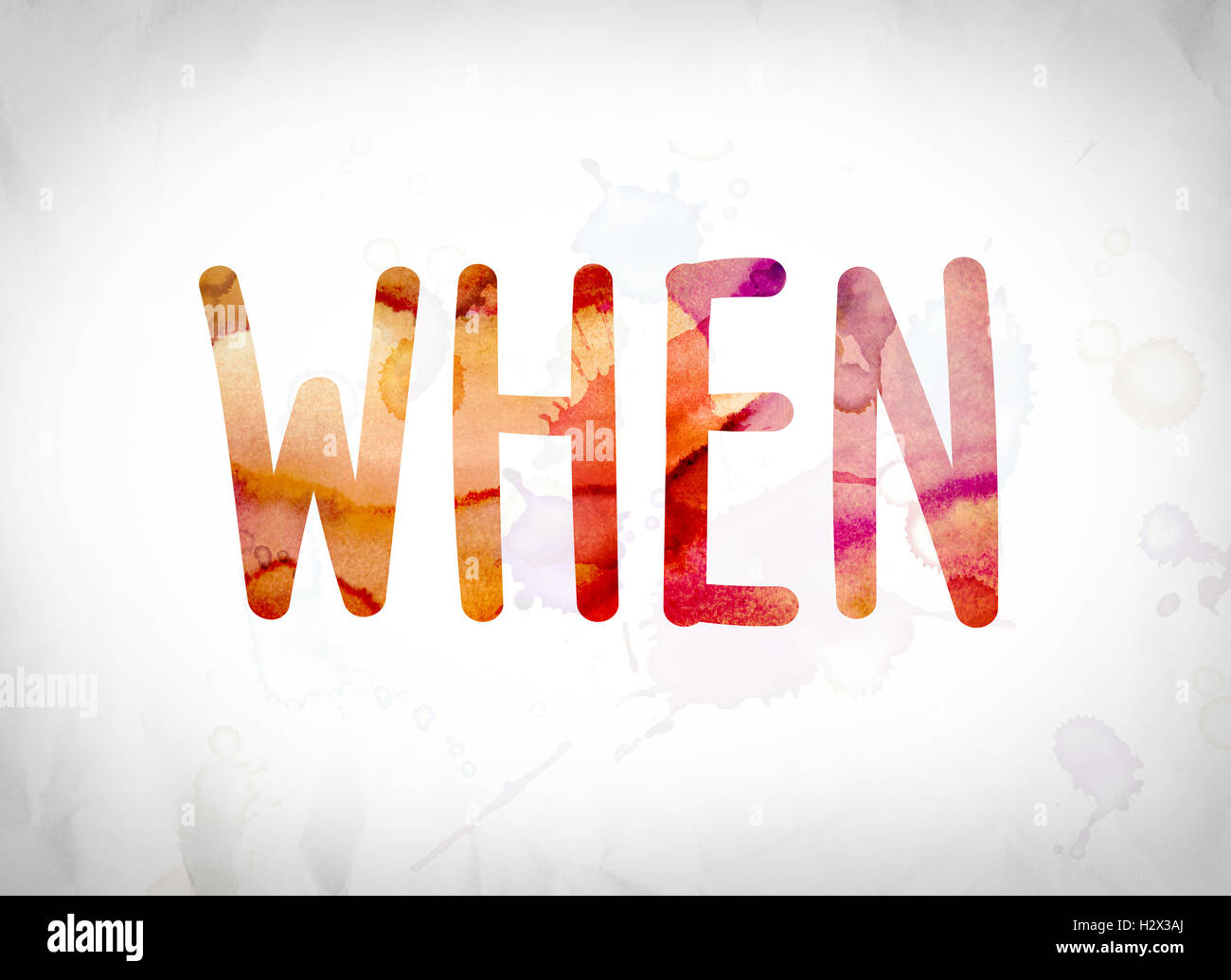 The word "When" written in watercolor washes over a white paper ...