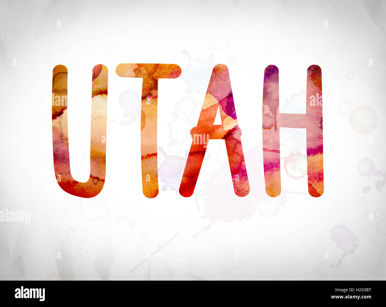 The word "Utah" written in watercolor washes over a white paper ...