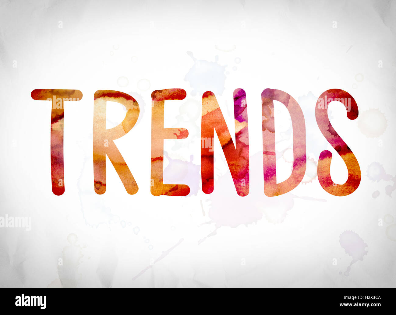 The word "Trends" written in watercolor washes over a white paper ...