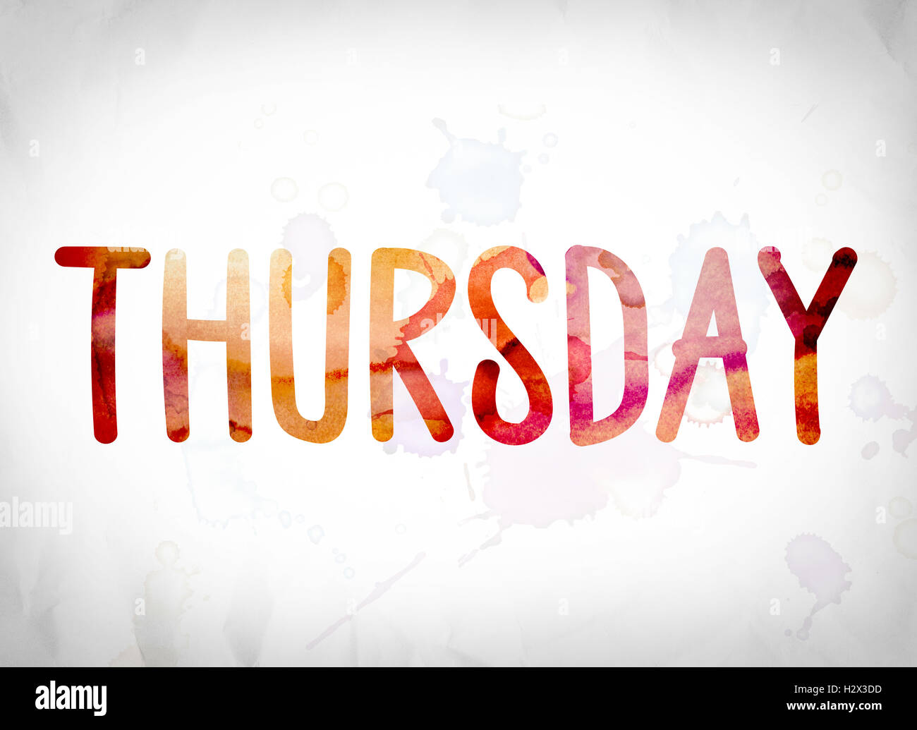 The word "Thursday" written in watercolor washes over a white paper ...