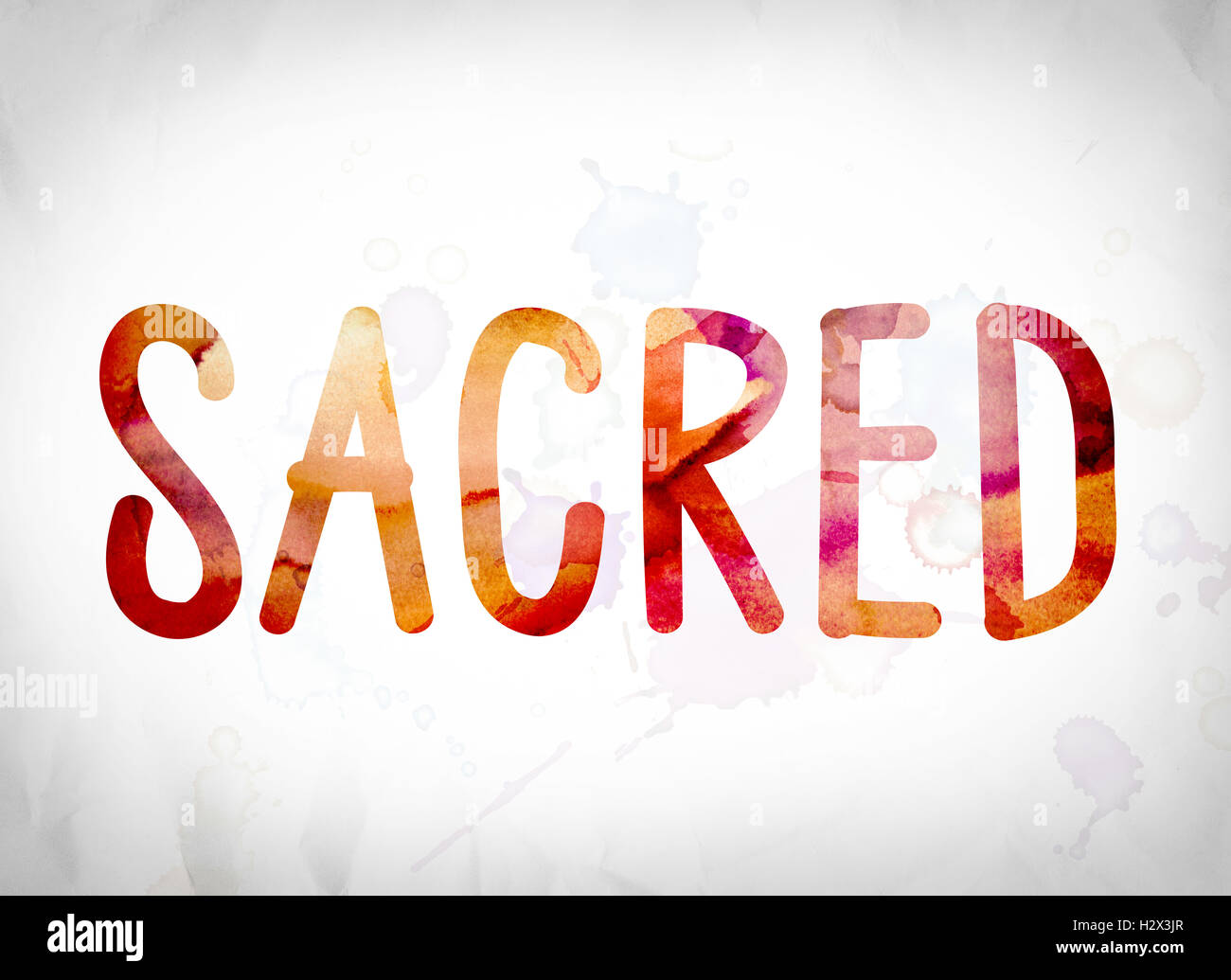 The word "Sacred" written in watercolor washes over a white paper ...