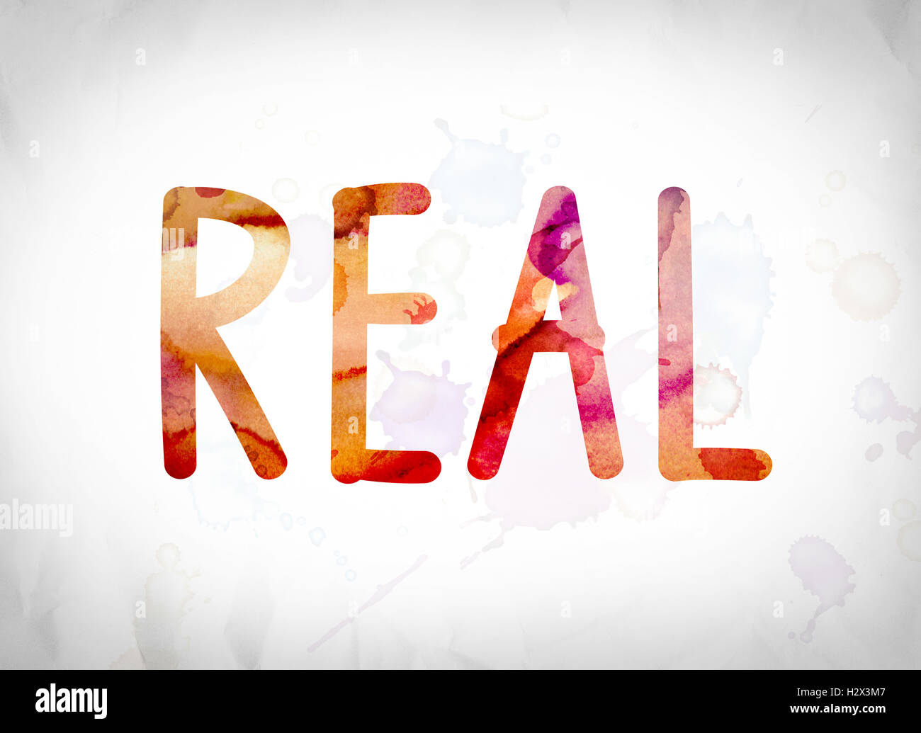 The word "Real" written in watercolor washes over a white paper ...