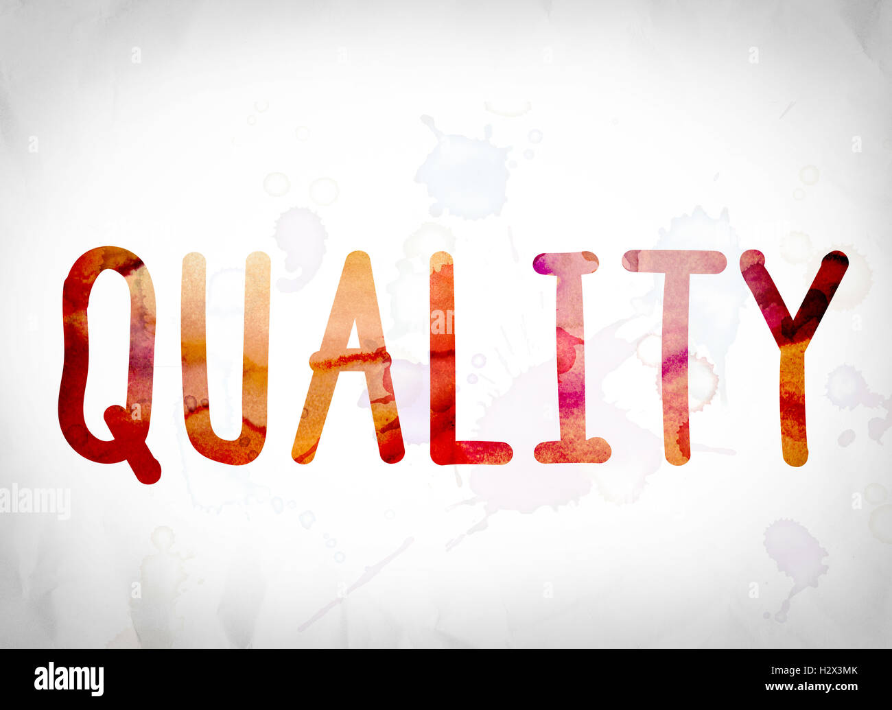 The word "Quality" written in watercolor washes over a white paper ...