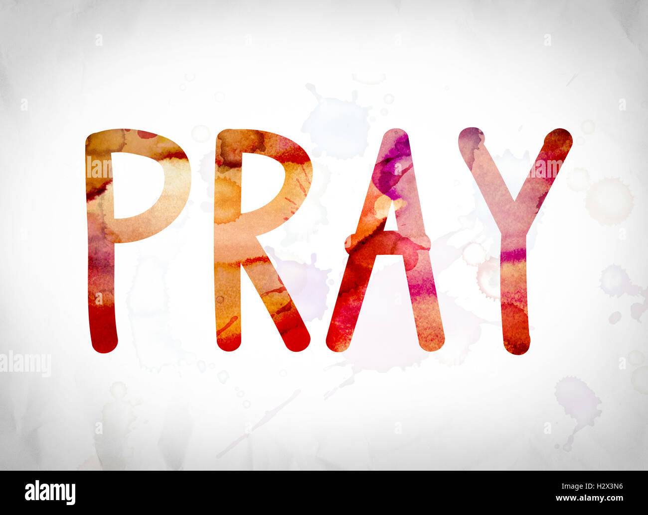 The word "Pray" written in watercolor washes over a white paper ...