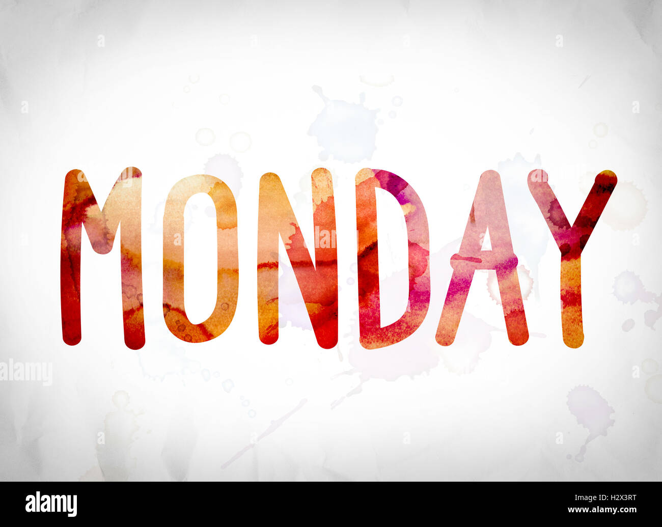 The word "Monday" written in watercolor washes over a white paper ...