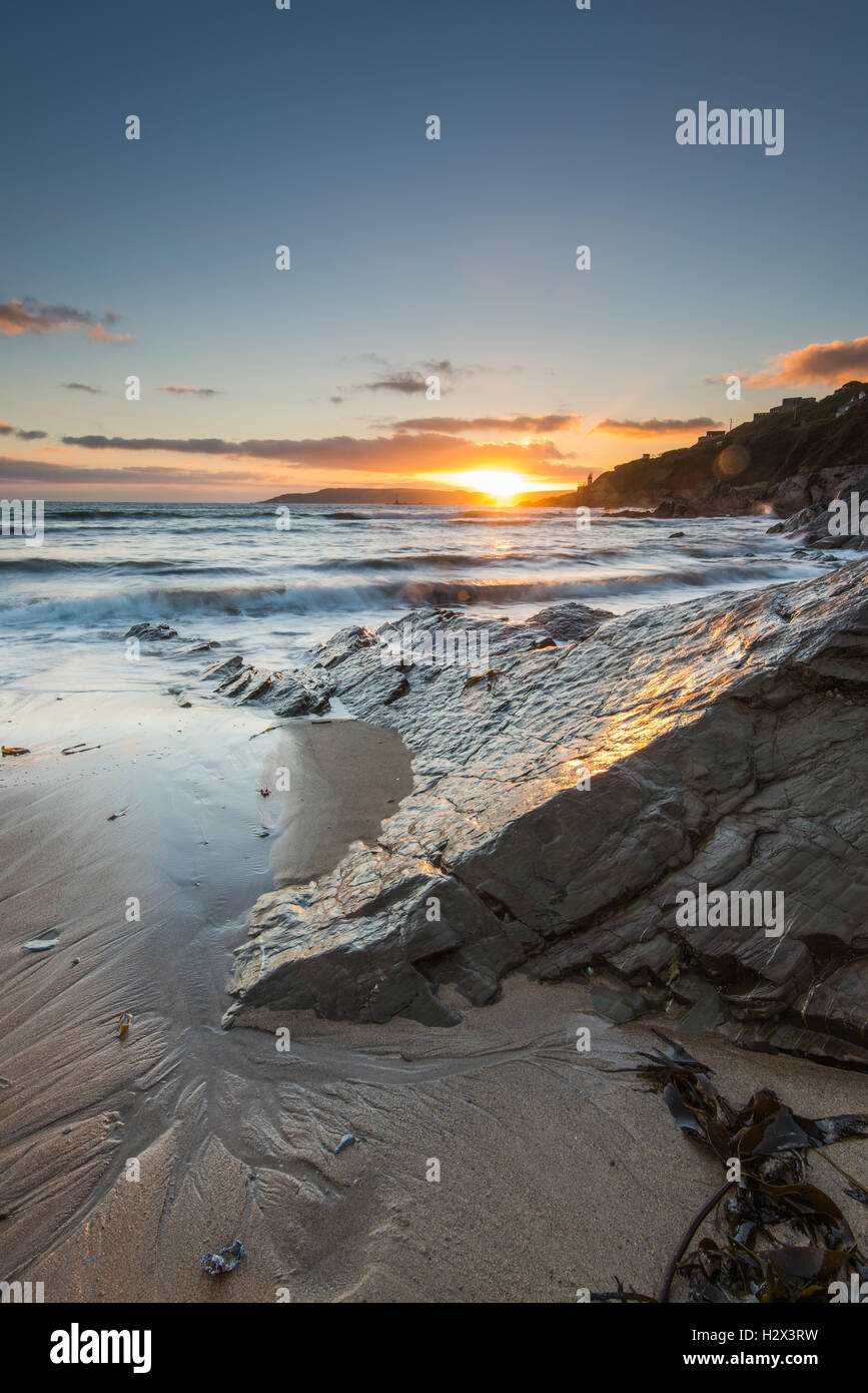 Serenity at sunset on the beach in Devon, UK Stock Photo - Alamy