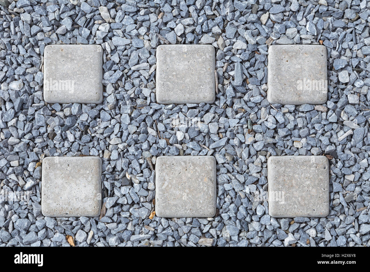 Pattern of concrete squares with stone pebbles in the walkway Stock ...