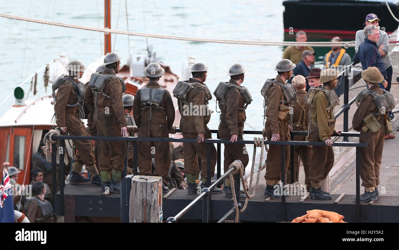 Harry Styles comes off a boat and walks along dock to get a cup of tea ...