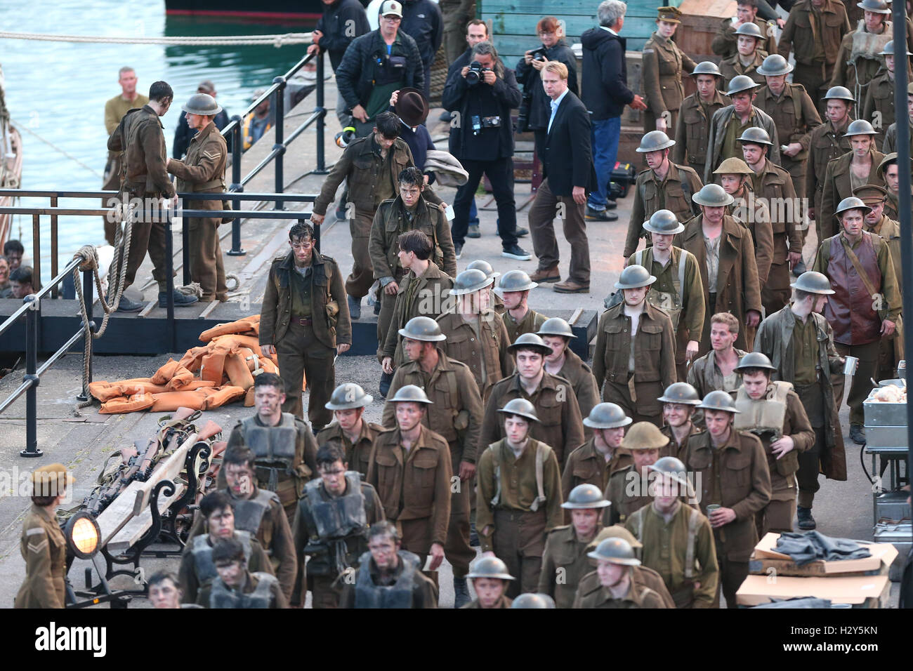 Harry Styles comes off a boat and walks along dock to get a cup of tea ...
