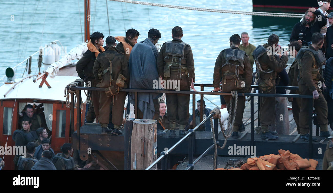 Harry Styles comes off a boat and walks along the dock. Featuring ...