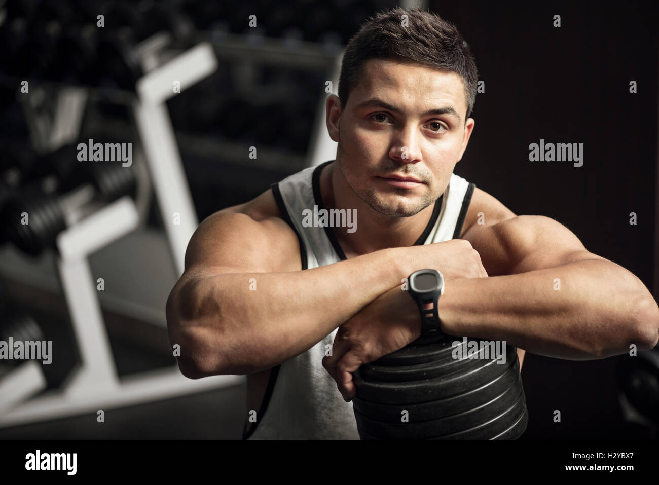 Confident good looking weightlifter having a workout Stock Photo - Alamy