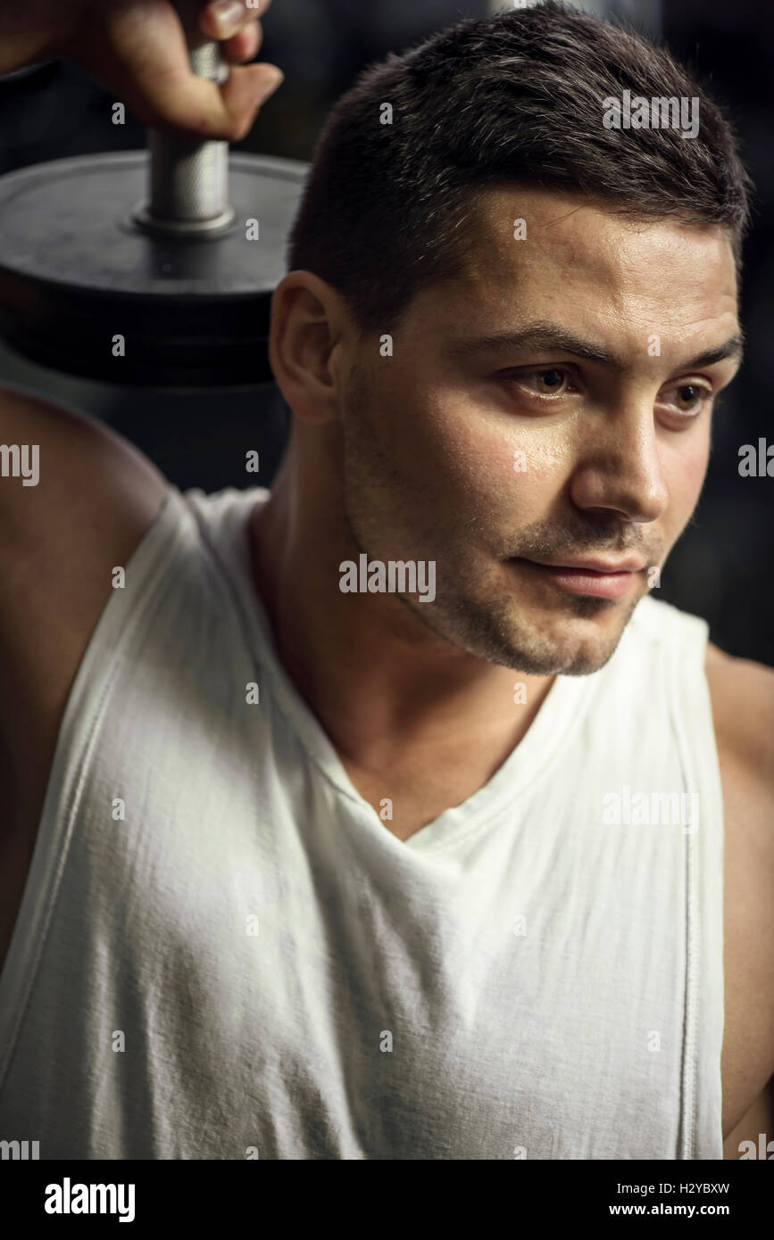 Handsome well built man lifting weight Stock Photo - Alamy
