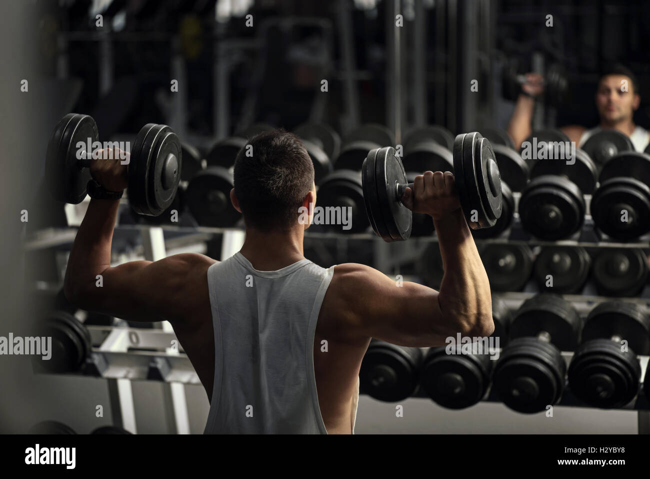 Male weightlifter dumbbells hi-res stock photography and images - Alamy