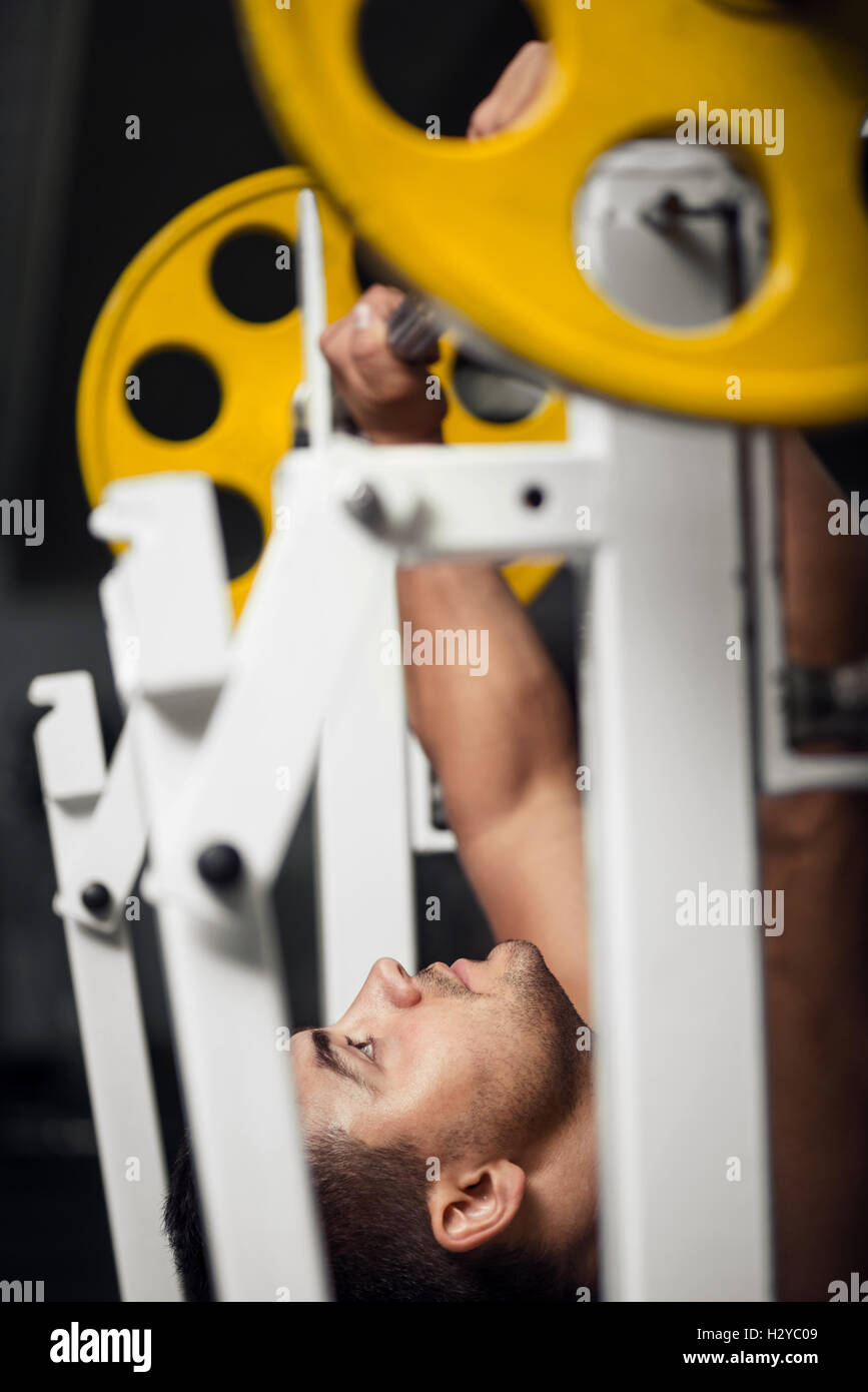 Strong male weightlifter lifting a barbell Stock Photo - Alamy