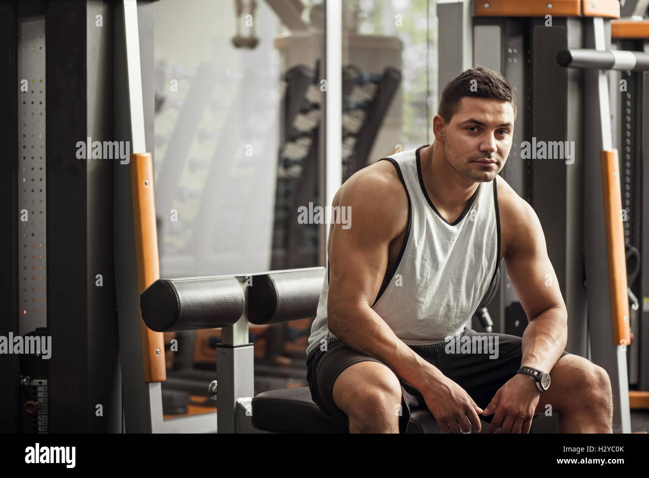 Good looking professional sportsman sitting in a gym Stock Photo - Alamy