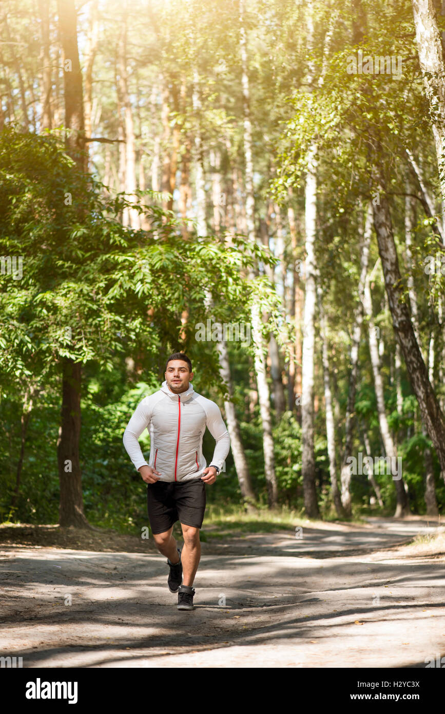 Handsome delighted runner enjoying nature Stock Photo - Alamy