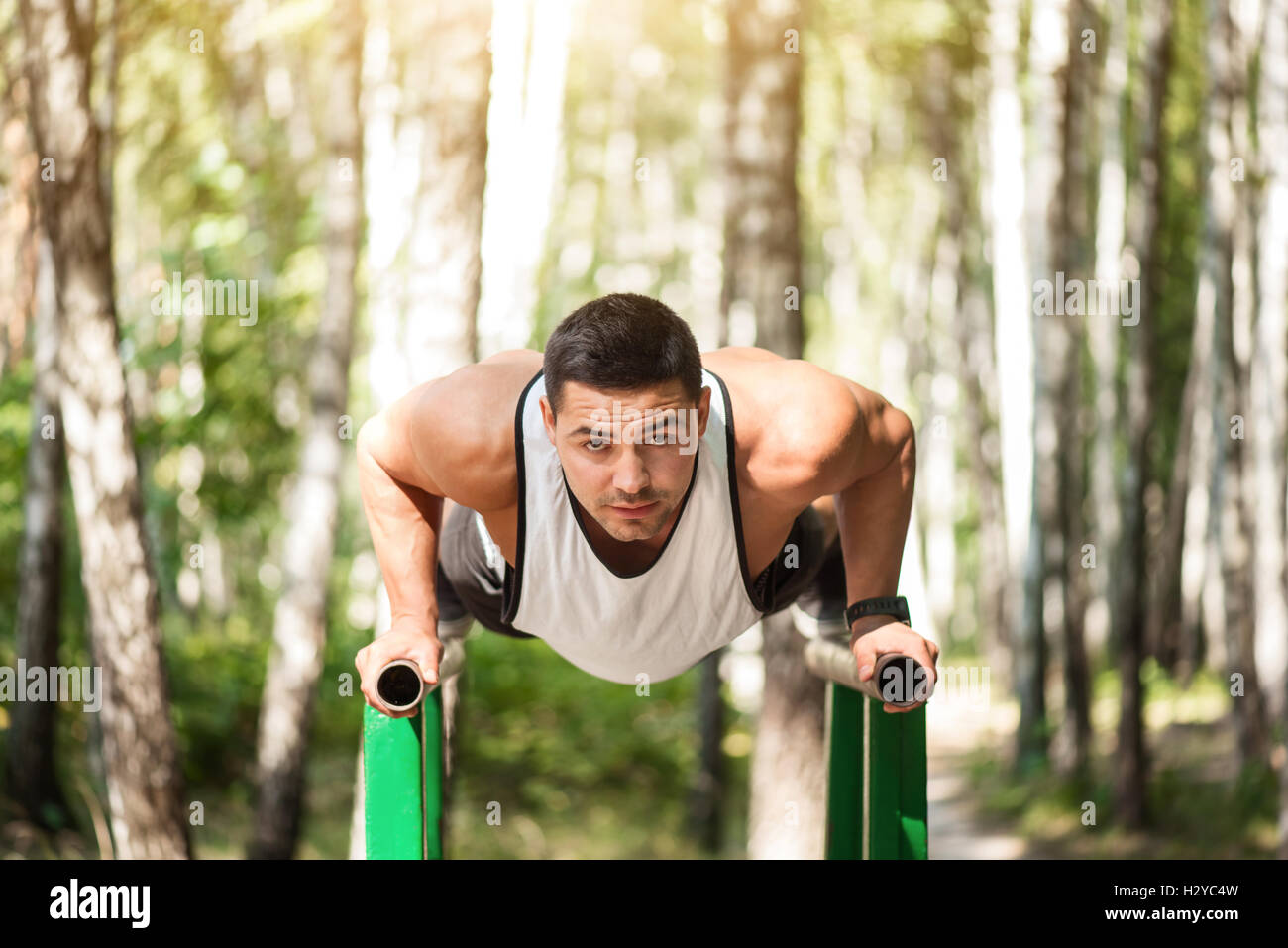 Good looking strong man doing push ups Stock Photo - Alamy