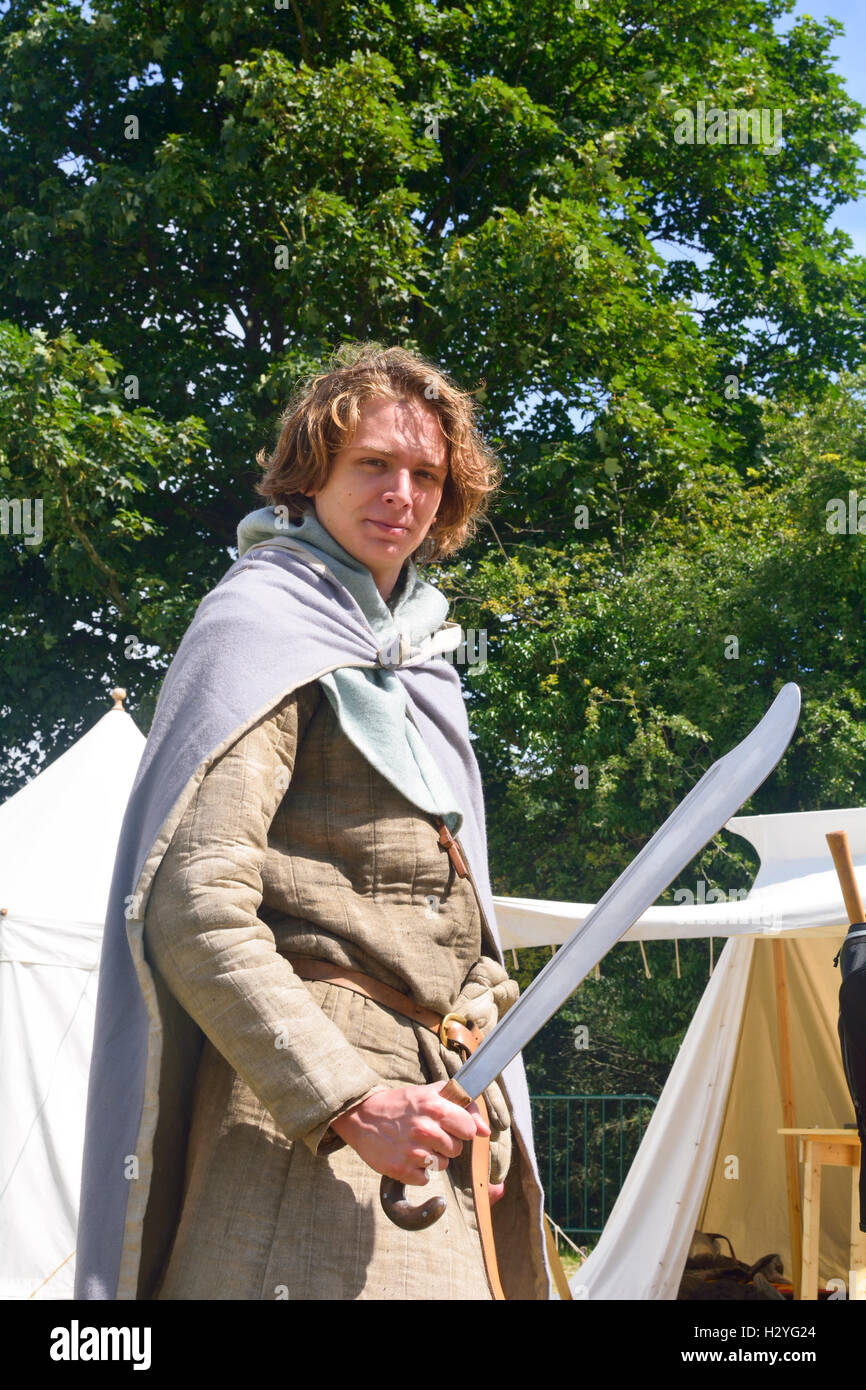 Historical Re-enactment group 12th Century knight in costume wielding ...