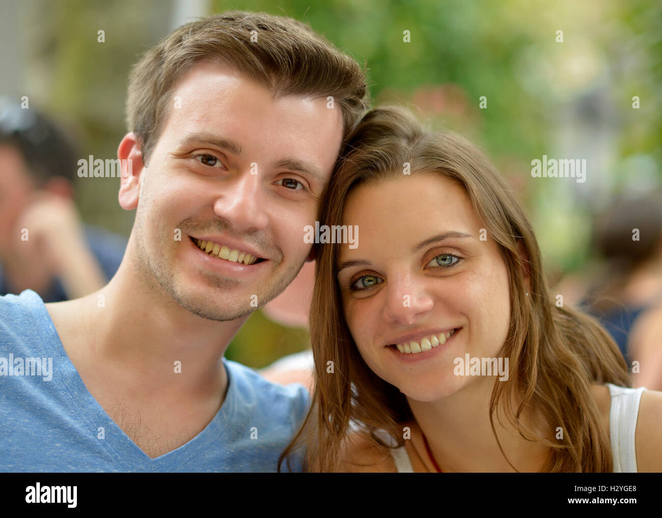 Young couple, leaning heads together, portrait, Germany Stock Photo - Alamy