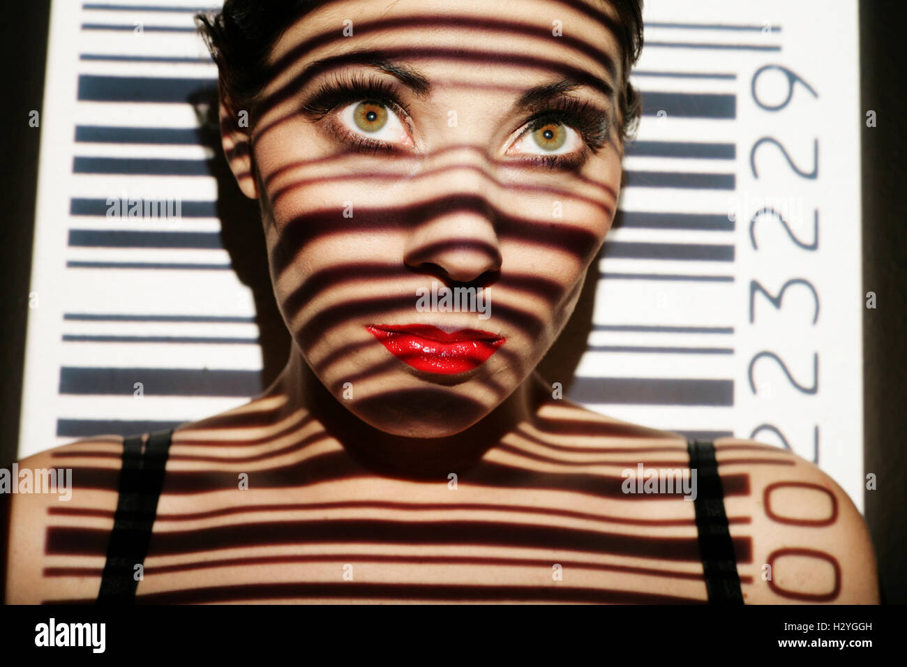 Woman portrait with projected bar code as a symbolic image for ...