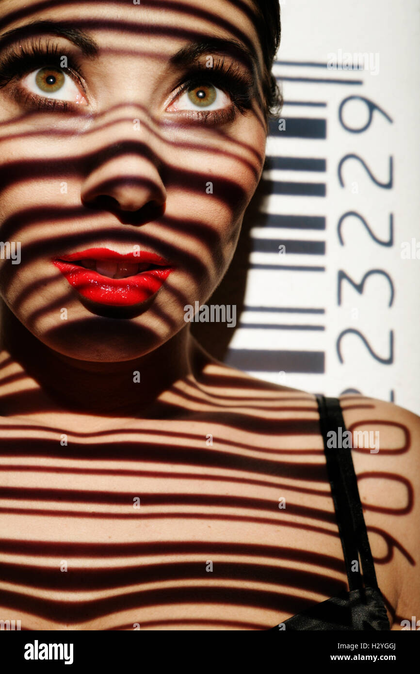 Woman portrait with projected bar code as a symbolic image for ...