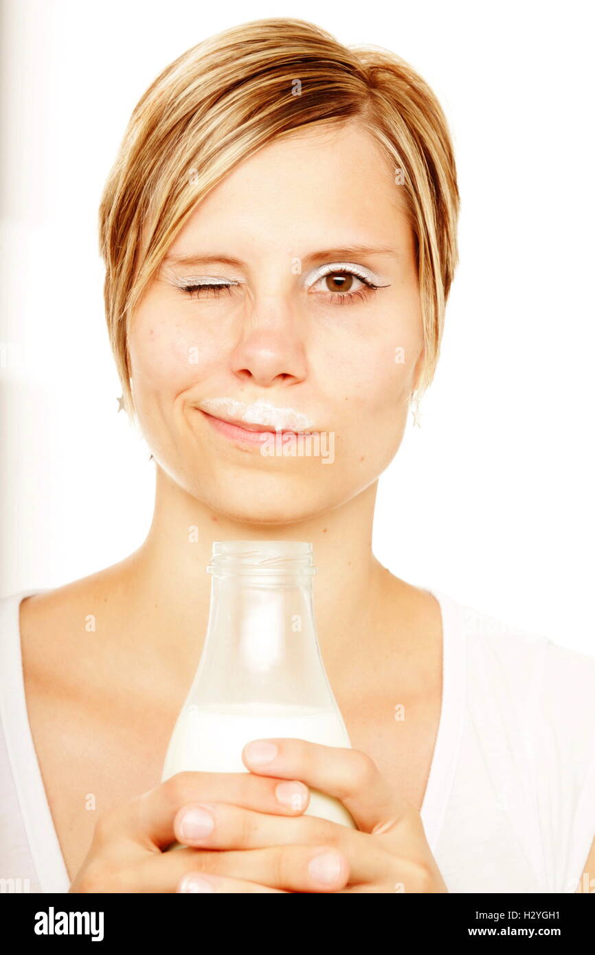 Woman with bottle of milk and milk mustache Stock Photo - Alamy