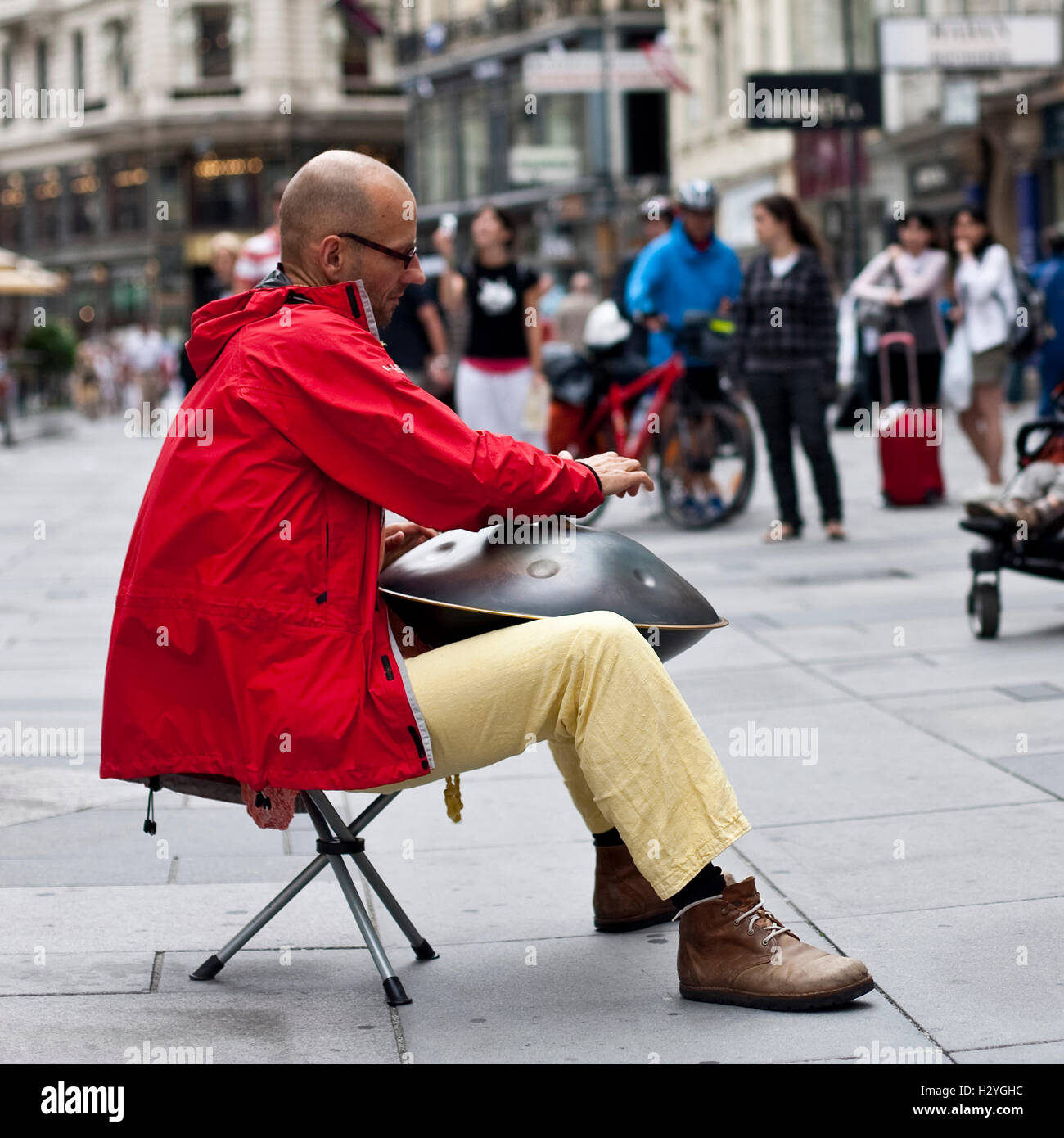 Busker playing a hang, a musical instrument, in the historic citycentre ...