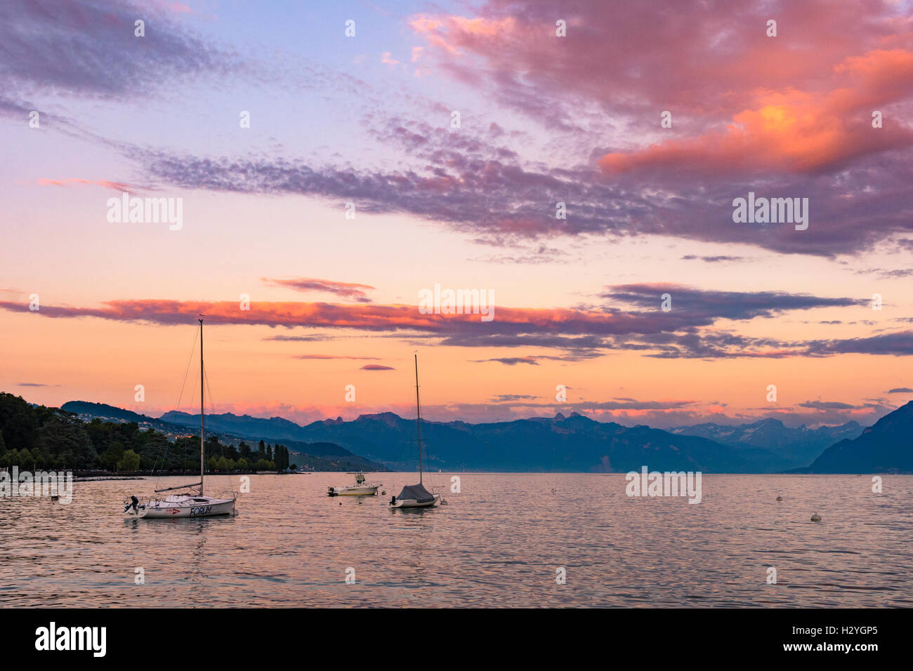 Sunset over boats on Lac Leman, Lausanne, Switzerland Stock Photo - Alamy