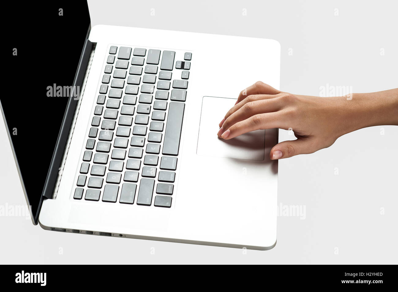 Hand operating a brand new laptop Stock Photo - Alamy