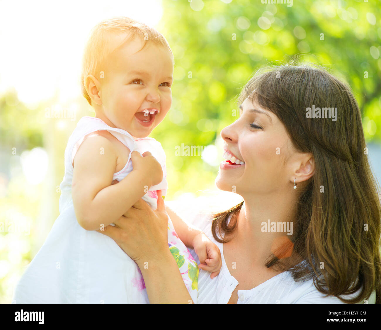 Beautiful Mother And Baby Outdoors. Nature Stock Photo - Alamy