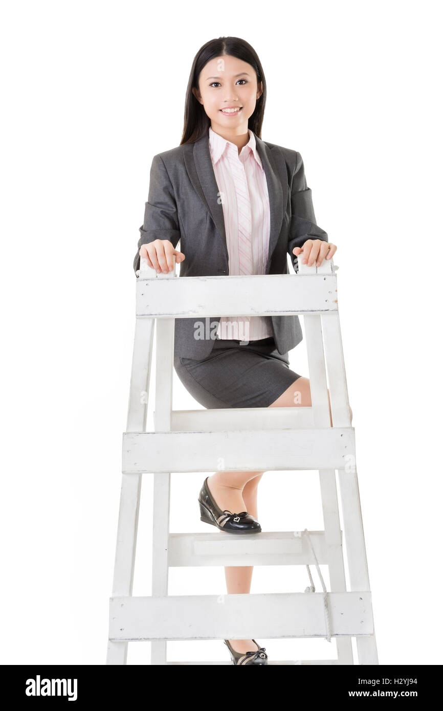 Asian business woman climb a ladder Stock Photo - Alamy
