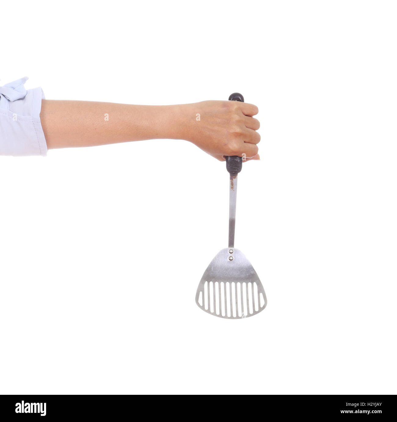 woman hand holding a kitchen spatula Stock Photo - Alamy