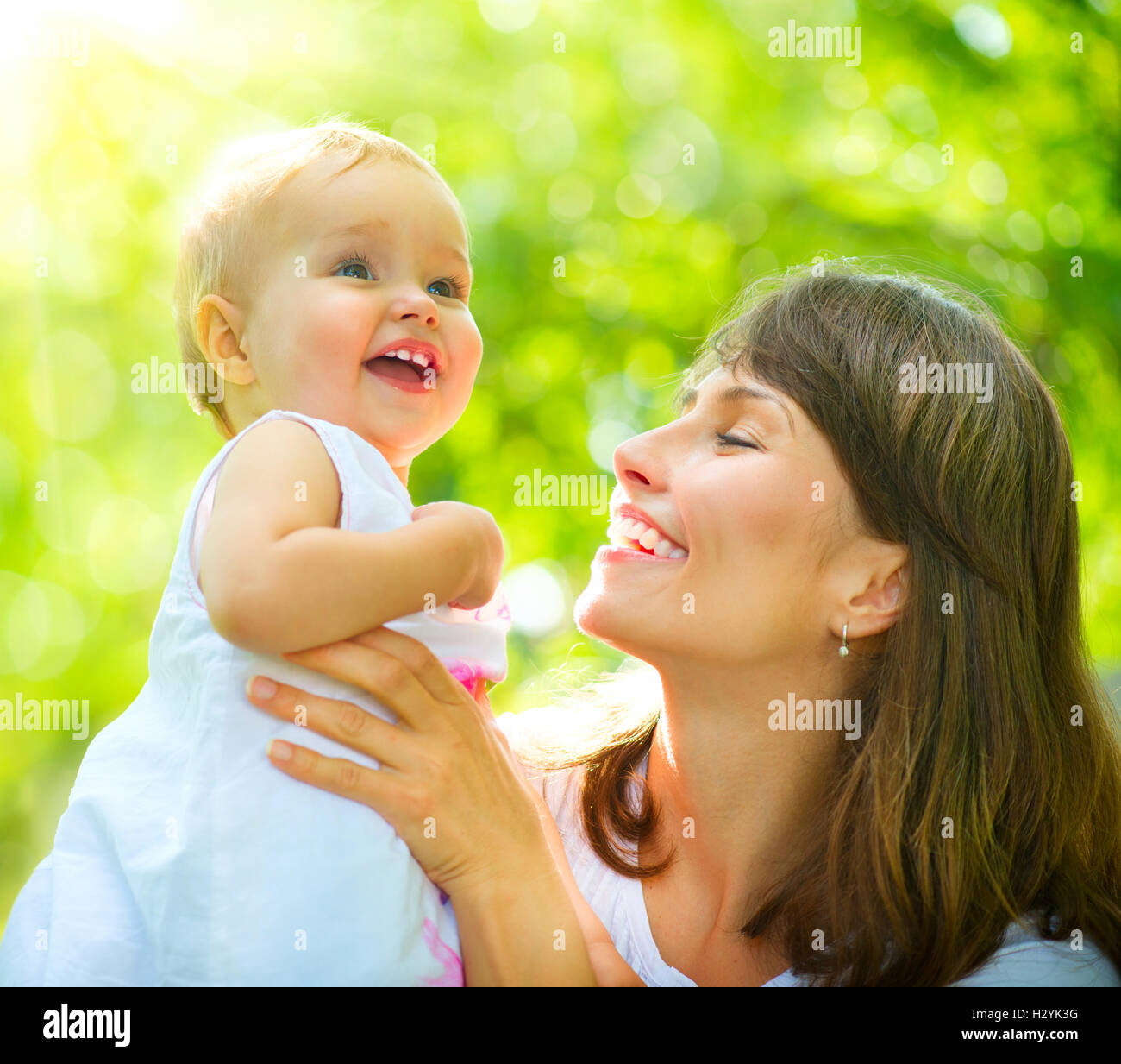 Beautiful Mother And Baby Outdoors. Nature Stock Photo - Alamy