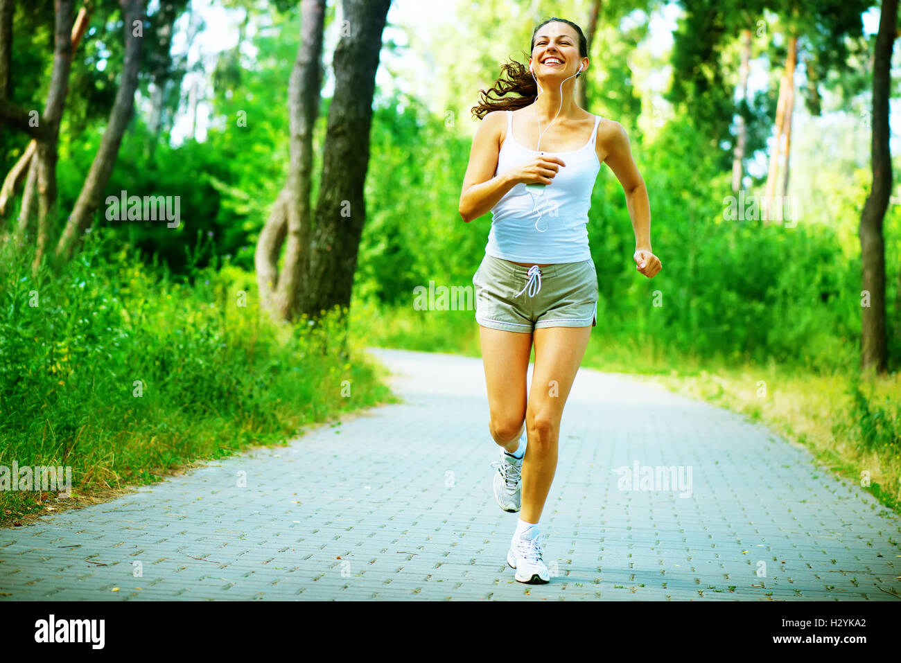 Running Woman. Outdoor Workout in a Park Stock Photo - Alamy